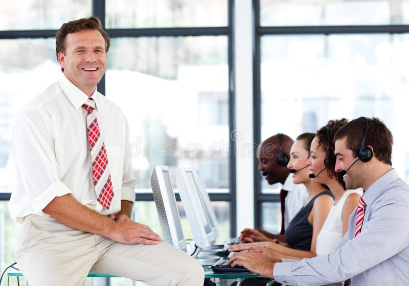 Smiling Mature Manager in a Call Center Stock Photo - Image of call ...