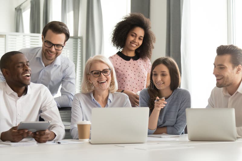 Smiling Mature Mentor Teaching Diverse Employees Team, Using Laptop ...