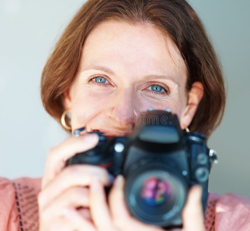 Smiling Mature Woman with a SLR Camera Stock Image - Image of lens ...