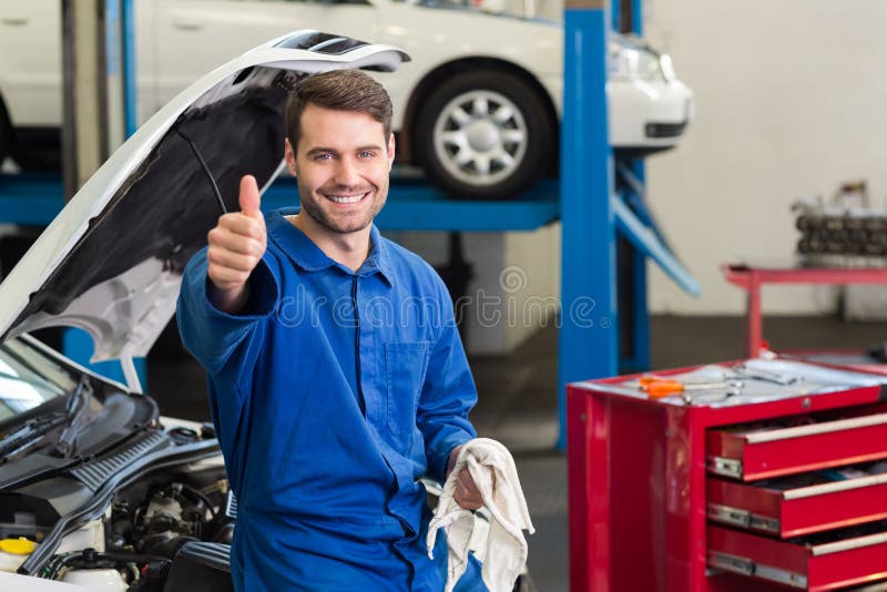 Smiling Mechanic stock photo. Image of professional, hair - 17220920