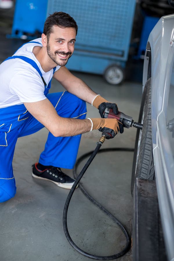 Smiling Mechanic with Tools Stock Image - Image of engine, profession ...