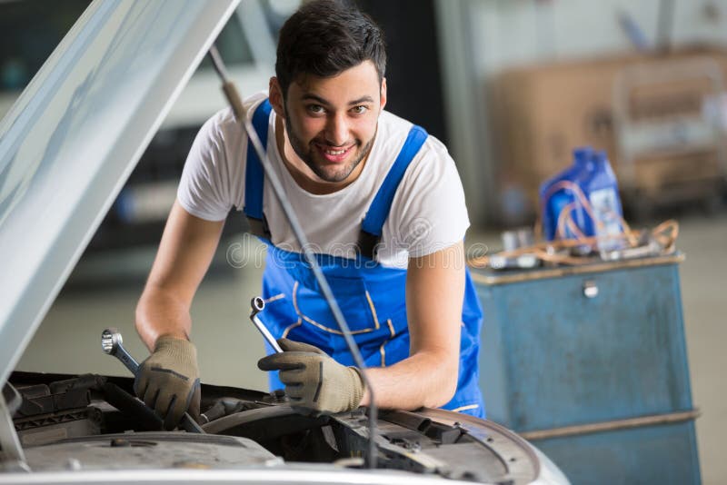Smiling Mechanic Working on Engine Stock Image - Image of repair, auto ...
