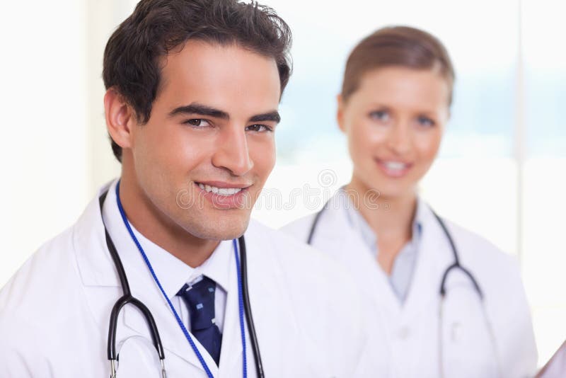 Smiling doctor man stock photo. Image of colleague, caucasian - 102540376