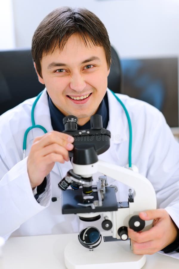 Doctor Working with Microscope in Laboratory Stock Photo - Image of ...