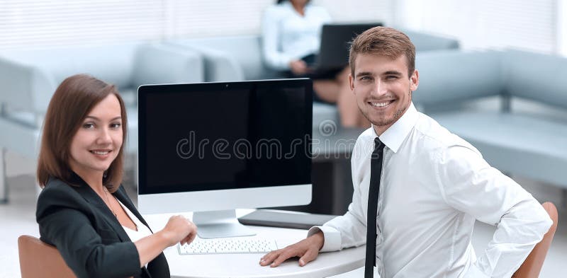 Smiling Member of the Business Team Sitting at Desk Stock Photo - Image ...