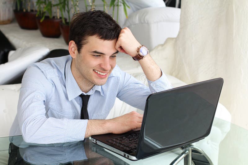 Smiling Men Think and Work at the Laptop Stock Image - Image of ...