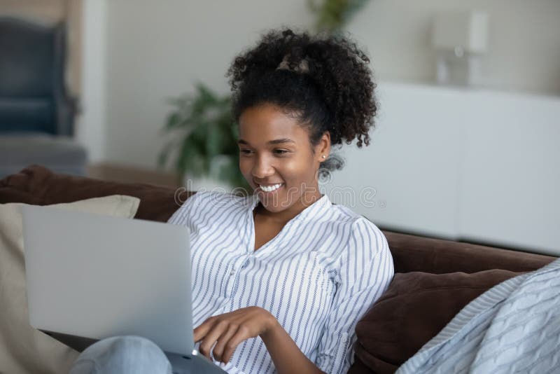 Smiling Millennial African Woman Using Computer at Home. Stock Image ...