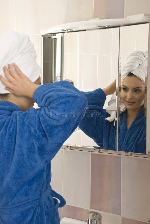 Smiling in a mirror stock image. Image of bathrobe, smile - 7093553