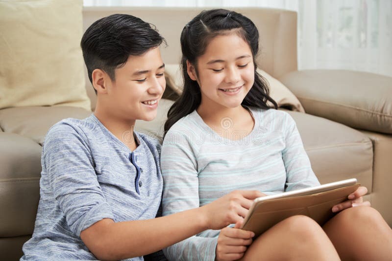 Reading siblings stock photo. Image of positive, entertainment - 124920472