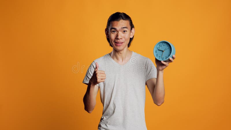 Smiling Model Looking at Wall Clock and Feeling Good Stock Image ...