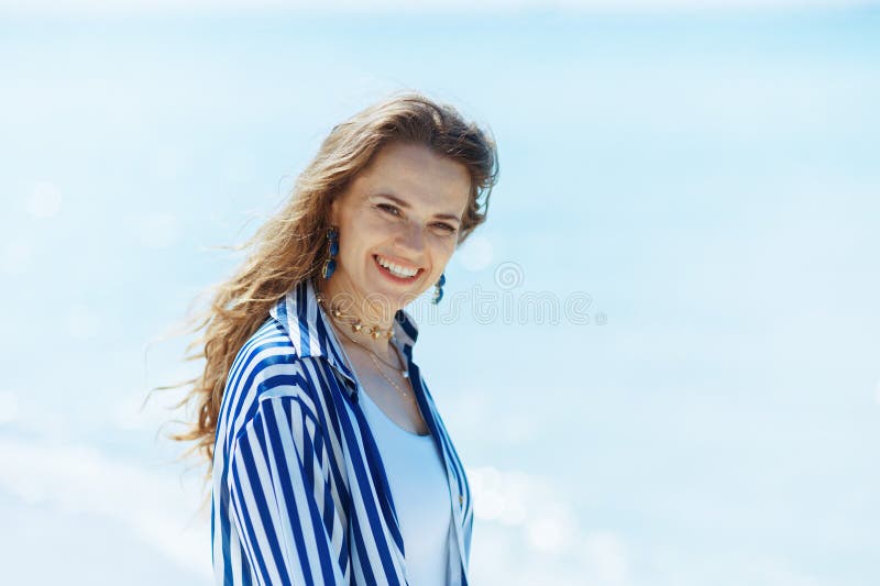 Smiling Modern Woman on Seashore Having Fun Time Stock Photo - Image of ...