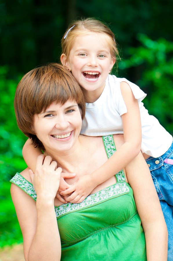 Smiling Mother and Daughter Stock Image - Image of life, outdoor: 25975495