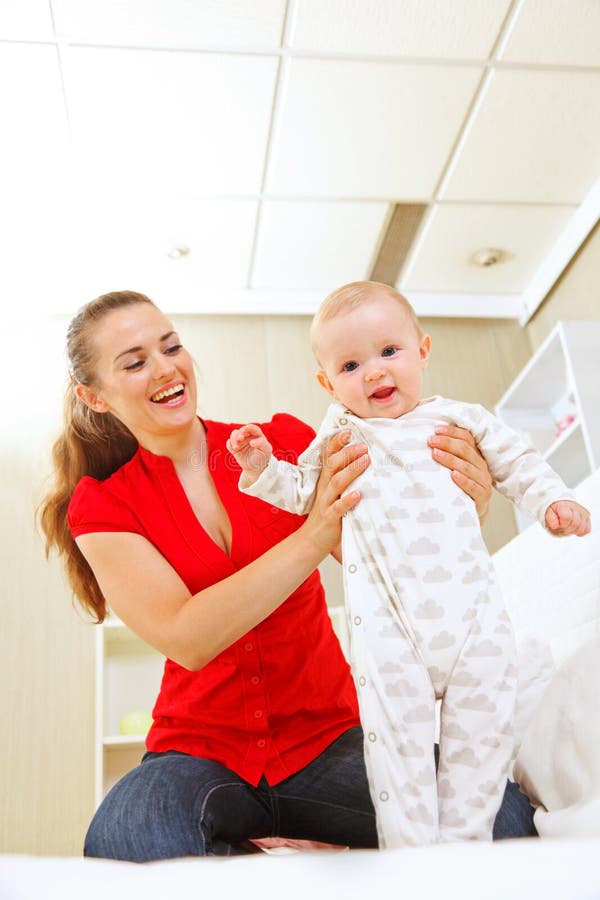 Smiling Mother Helping Baby Learn To Walk Stock Image - Image of ...