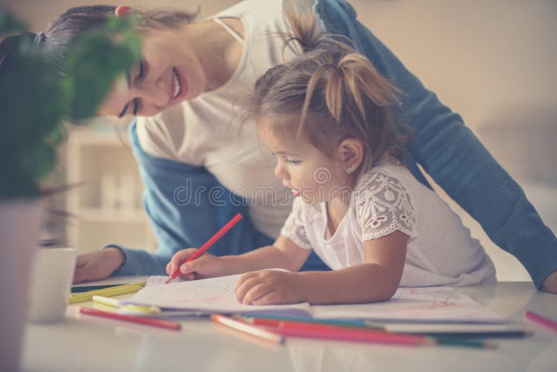 Mother Teaching Her Daughter To Drawing and Writing at H Stock Photo ... Mother Teaching Her Daughter To Drawing and Writing at H Stock Photo ...