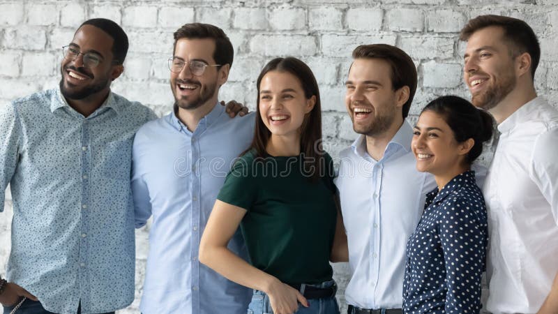 Smiling Motivated Successful Diverse Employees Team Standing in Office ... Smiling Motivated Successful Diverse Employees Team Standing in Office ...