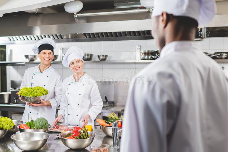 Smiling Multicultural Chefs Looking at Each Other Stock Photo - Image ...