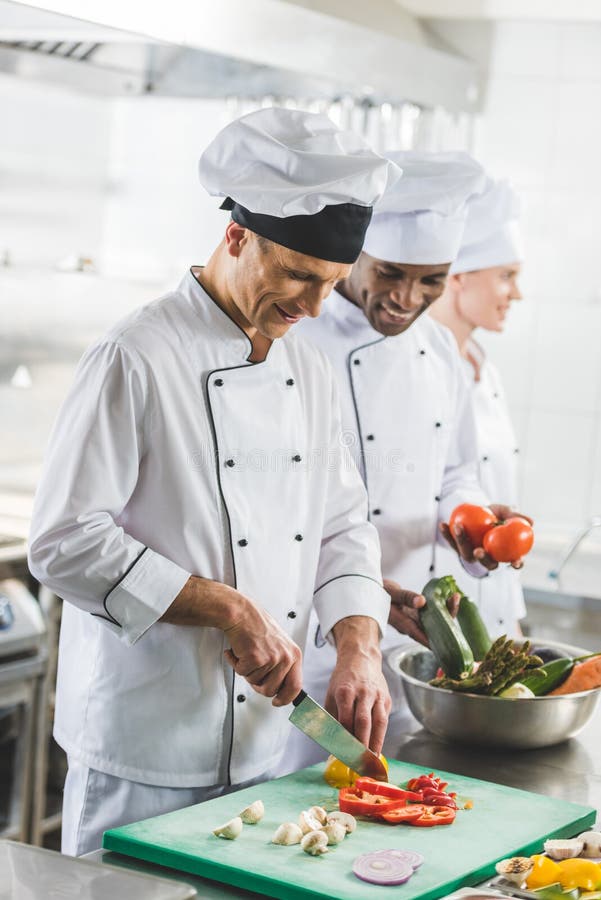 Smiling Multicultural Chefs Preparing Food Stock Photo - Image of ...
