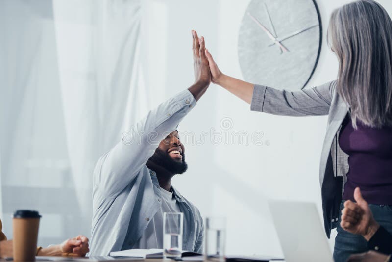 Multicultural Colleagues Giving High Five in Stock Image - Image of ...
