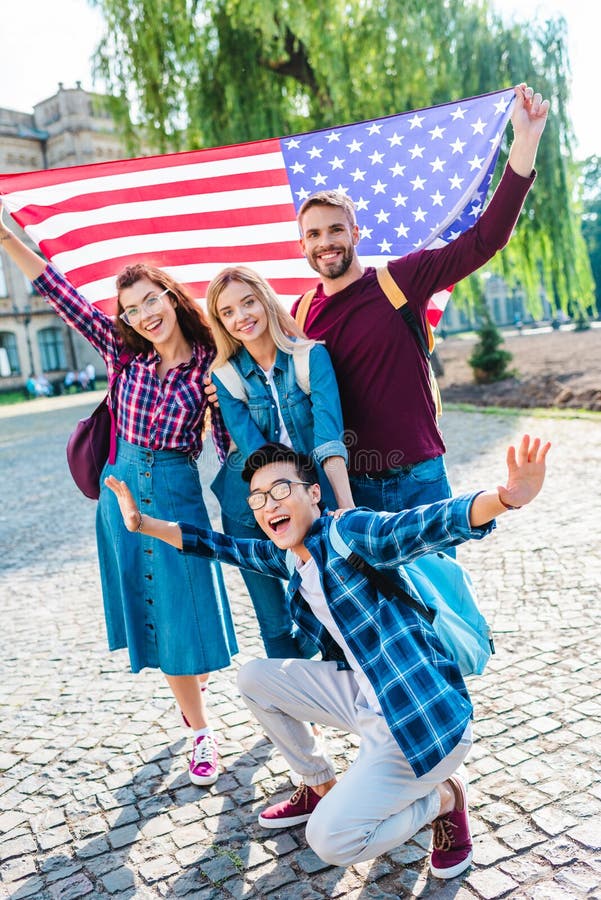 Smiling Multicultural Students with American Flag Stock Photo - Image ...