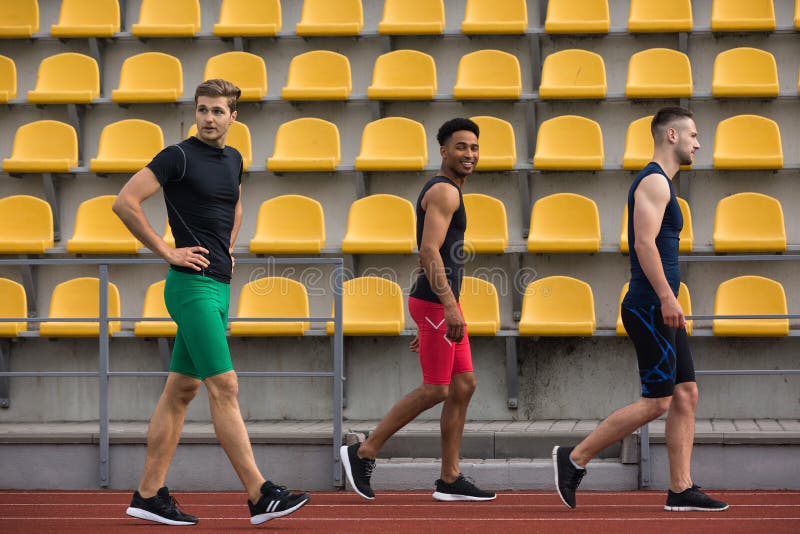 Smiling Multiethnic Athlete Group on Running Track Stock Image - Image ...