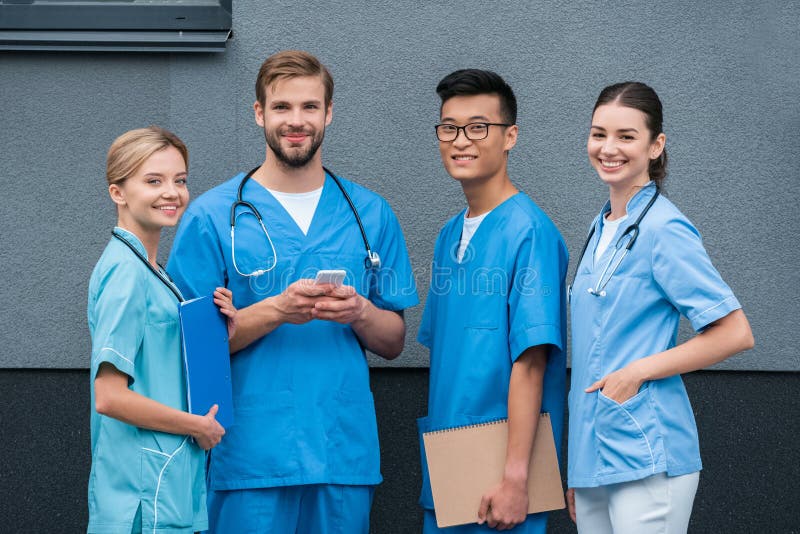 Smiling Multiethnic Medical Students Looking at Camera Near Medical ...