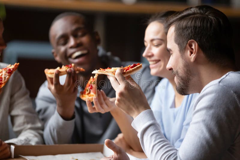 Overjoyed Diverse Colleagues Eating Tasty Pizza Laughing Having Fun