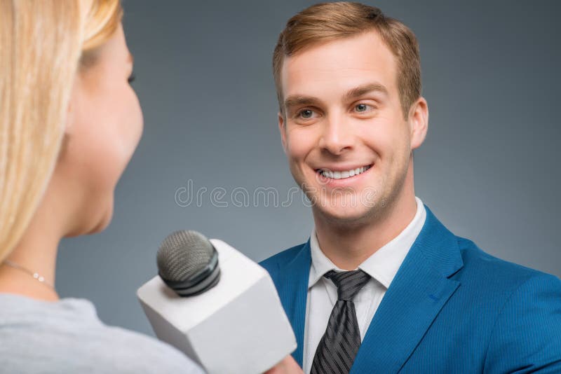 Smiling Newsman Taking an Interview Stock Image - Image of ...