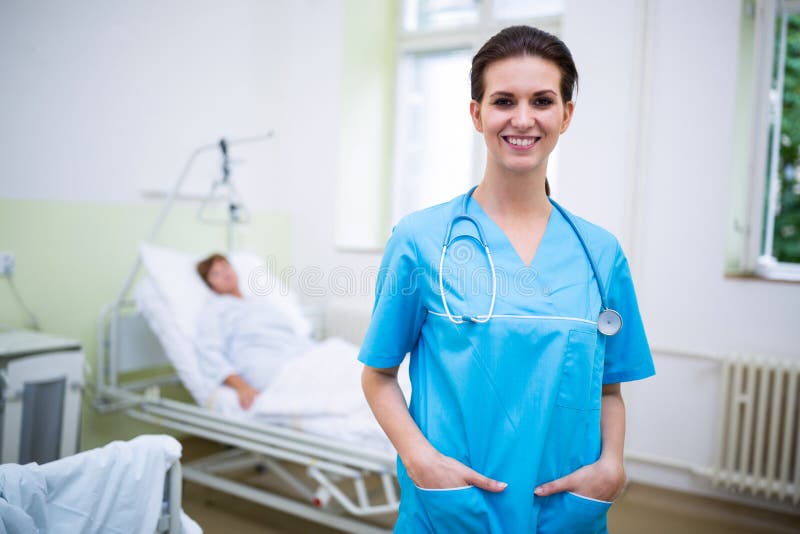 Smiling Nurse Standing with Hands in Pocket Stock Image - Image of ...