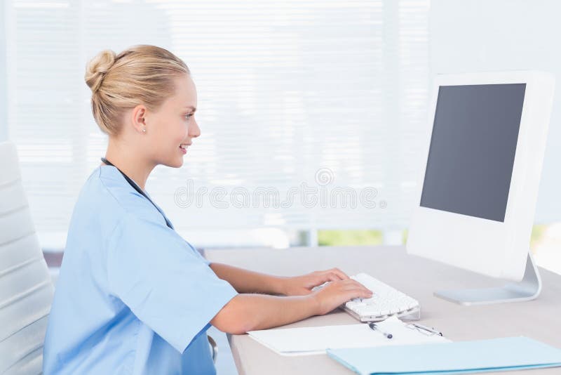 Smiling Nurse Using Computer Stock Image - Image of examining, adult ...