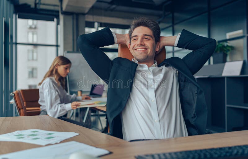 Smiling Office Worker Holding Hands Behind Head while Sitting at ...