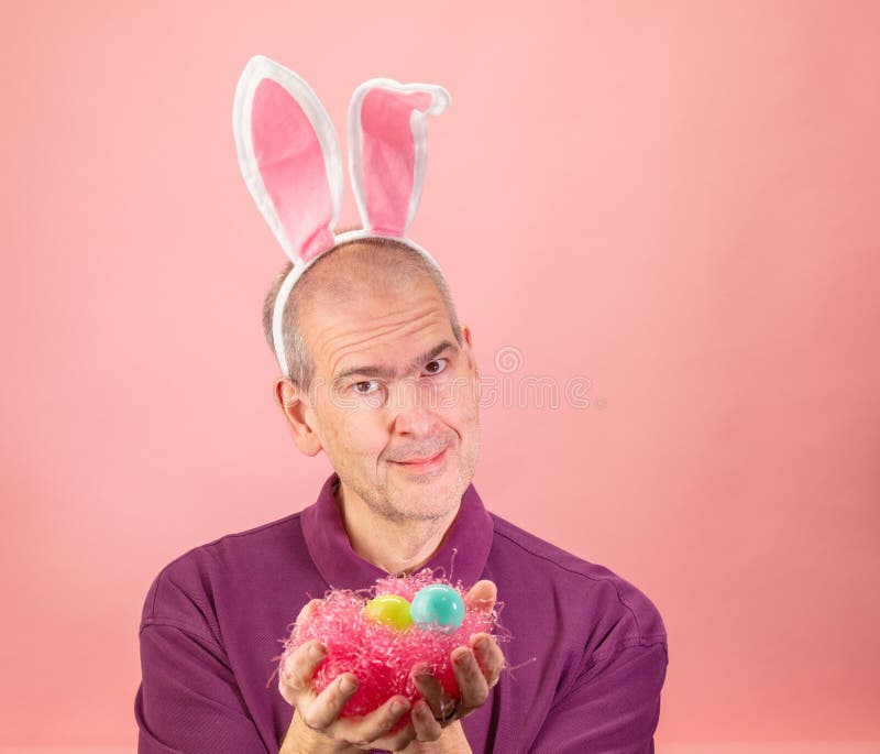 Smiling Old Man with Easter Bunny Ears and Plastic Eggs Stock Image ...