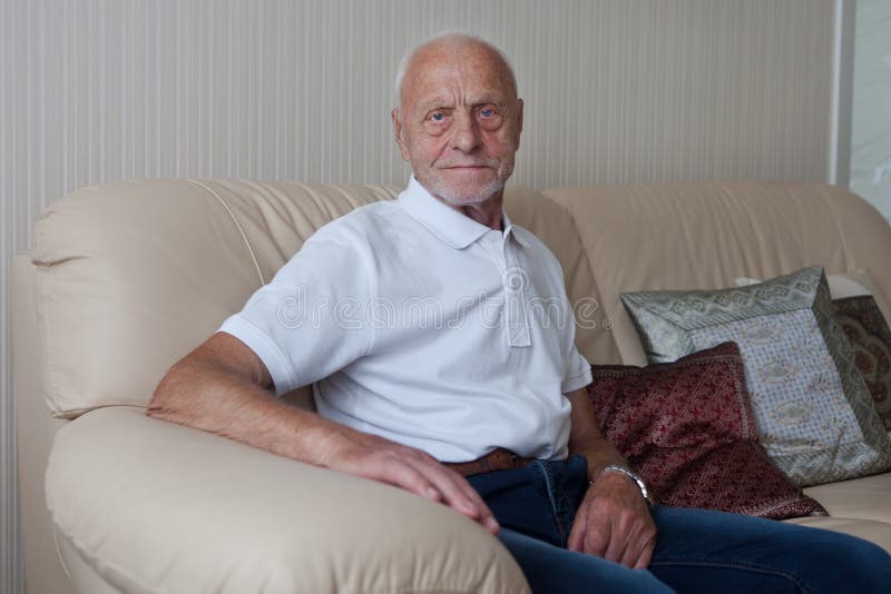 Smiling Old Man Sitting on Sofa Stock Photo - Image of appartement ...