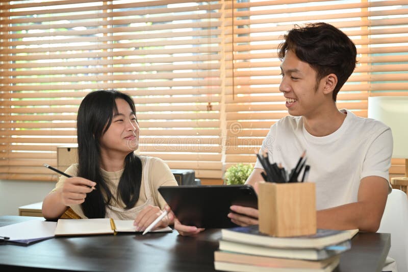Smiling Older Brother Explaining Homework Assignment, Helping Young ...