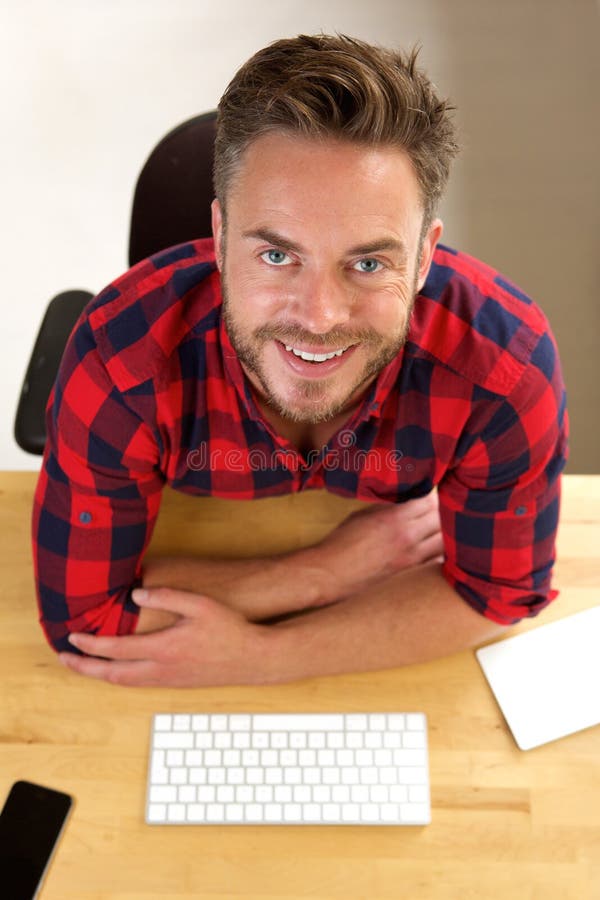Smiling Older Man Sitting at Desk with Keyboard Stock Photo - Image of ...