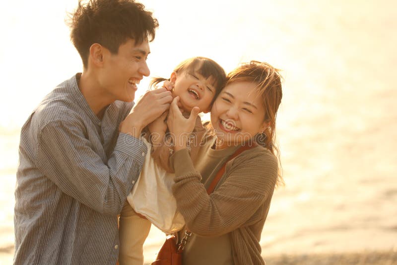 Smiling Parents and Children Stock Image - Image of evening, mother ...