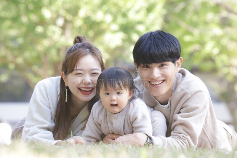 Smiling Parents and Children Stock Photo - Image of outdoors, woman ...