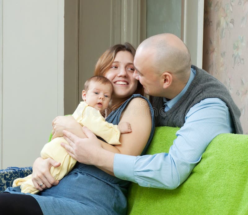 Smiling Parents with Children Spending Time Playing with Smartphones ...