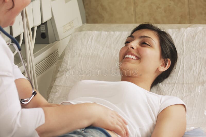 Smiling patient on couch stock photo. Image of examination - 16033088