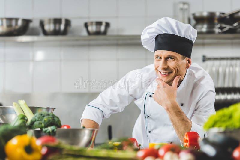 Smiling Pensive Chef Looking at Camera Stock Photo - Image of ...