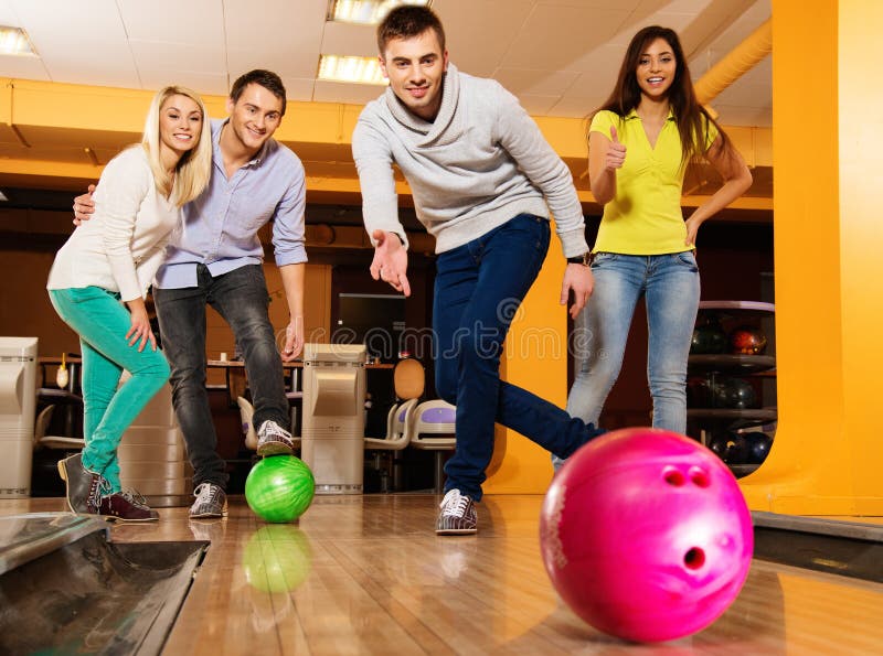 Smiling People Playing Bowling Stock Image - Image of indoor, brunette ...