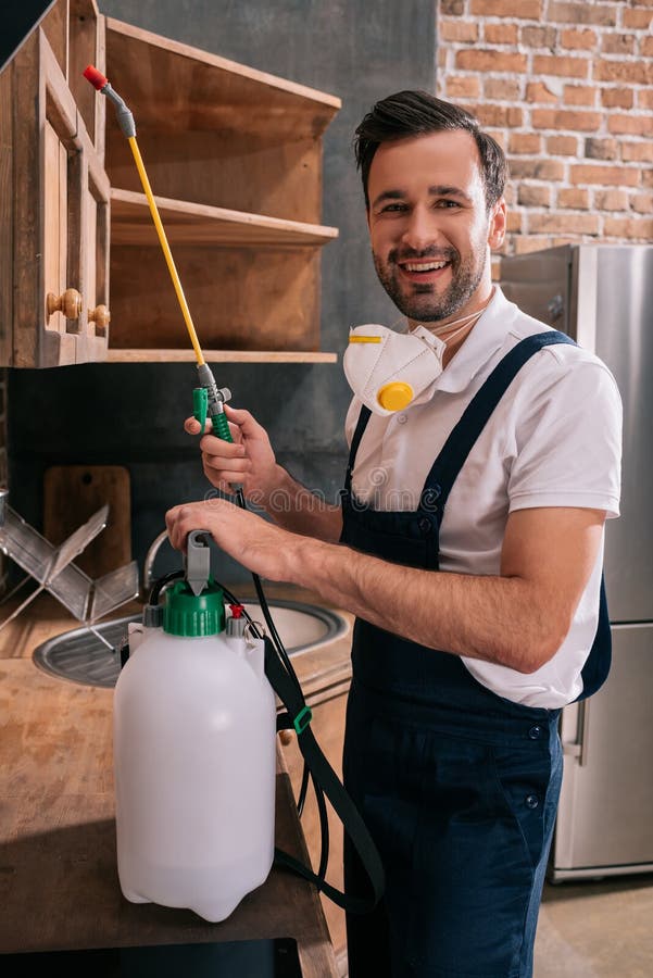 Smiling Pest Control Worker Holding Sprayer Stock Image - Image of ...