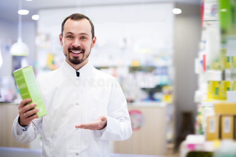 Smiling Pharmacist Showing Assortment Stock Photo - Image of indoors ...