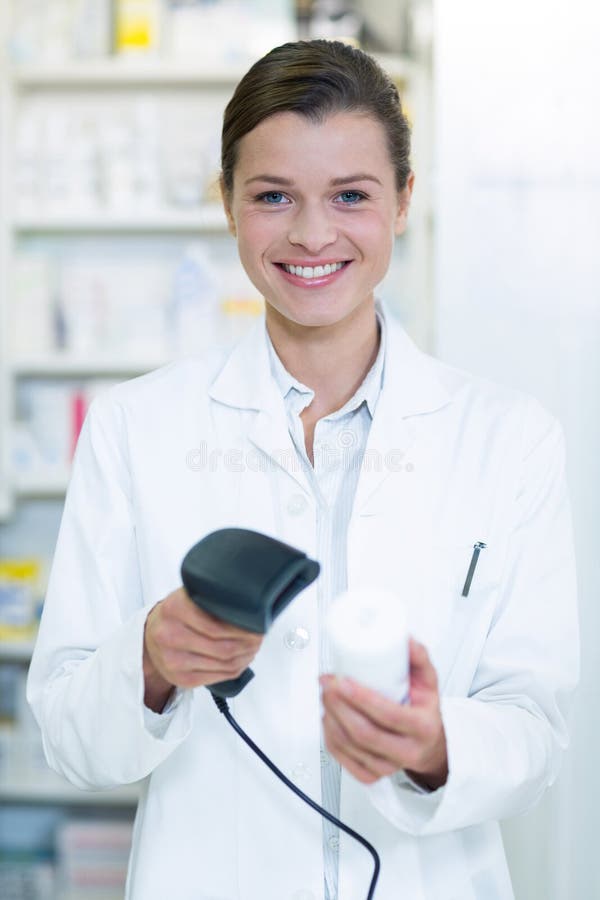 Smiling Pharmacist Using Barcode Scanner on Medicine Bottle in Pharmacy ...