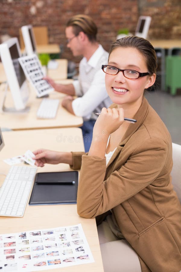 Smiling Photo Editors Using Computers In Office Stock Photo - Image of ... Smiling Photo Editors Using Computers In Office Stock Photo - Image of ...