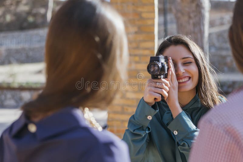 Smiling Photographer Taking Shot Stock Photo - Image of closed, long ...