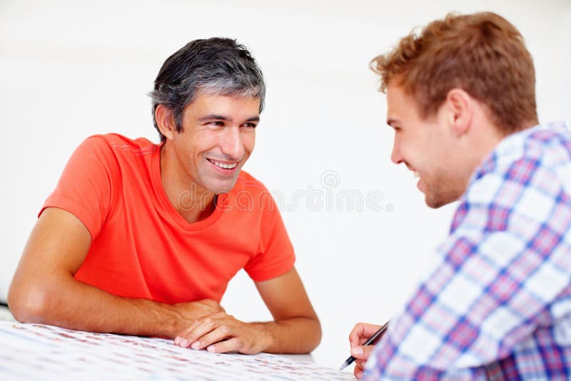 Smiling Photographers in Discussion. Two Smiling Photographers Sitting ...
