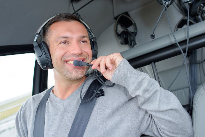 Smiling pilot in aircraft stock image. Image of private - 132206639