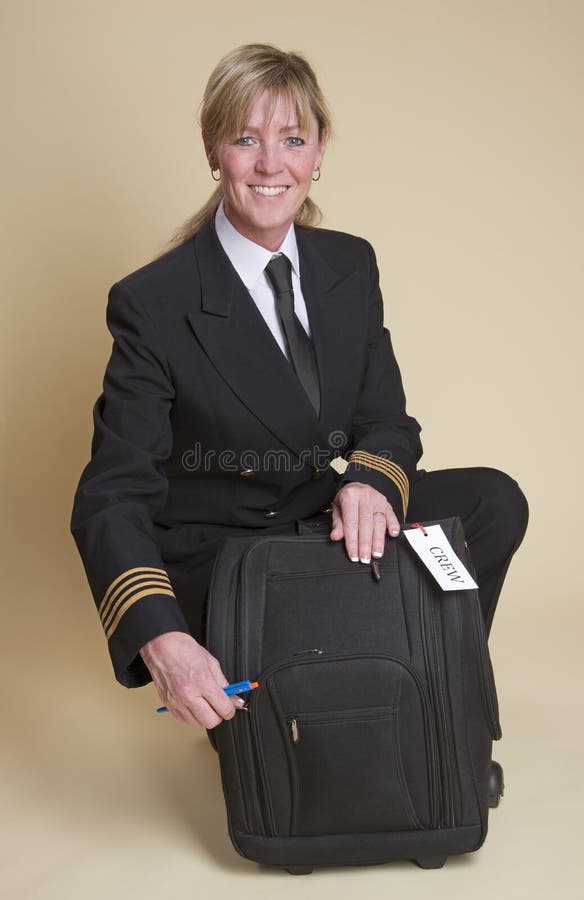Female Flight Crew Member Getting Dressed Stock Photo - Image of member ...