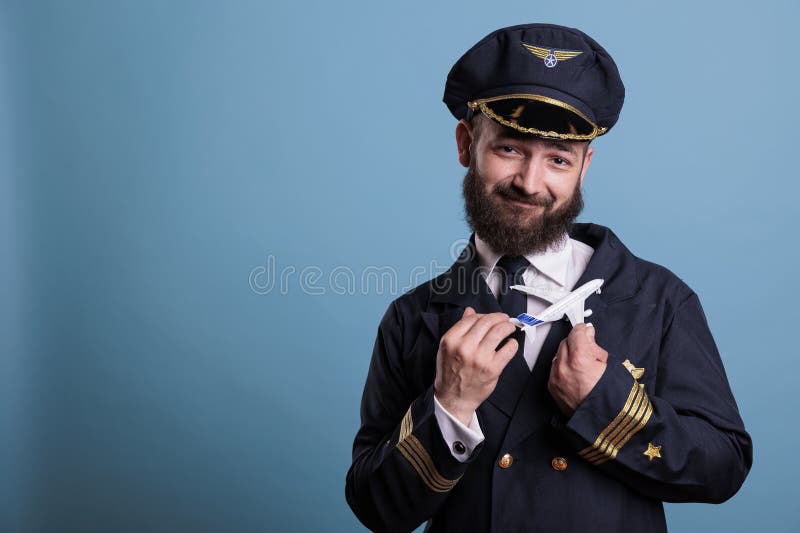 Smiling Pilot with Uniform Playing with Airplane Model Stock Photo ...