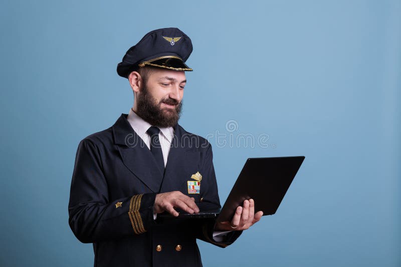Smiling Pilot Using Laptop, Typing Message Side View Stock Photo ...